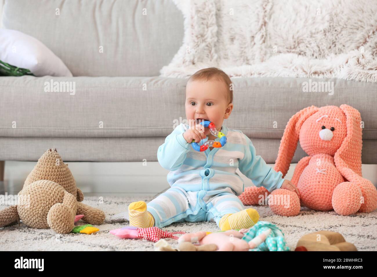 Cute little baby playing with toys at home Stock Photo - Alamy