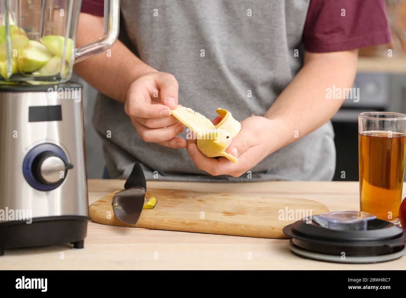 Man making healthy smoothie at home, closeup Stock Photo - Alamy
