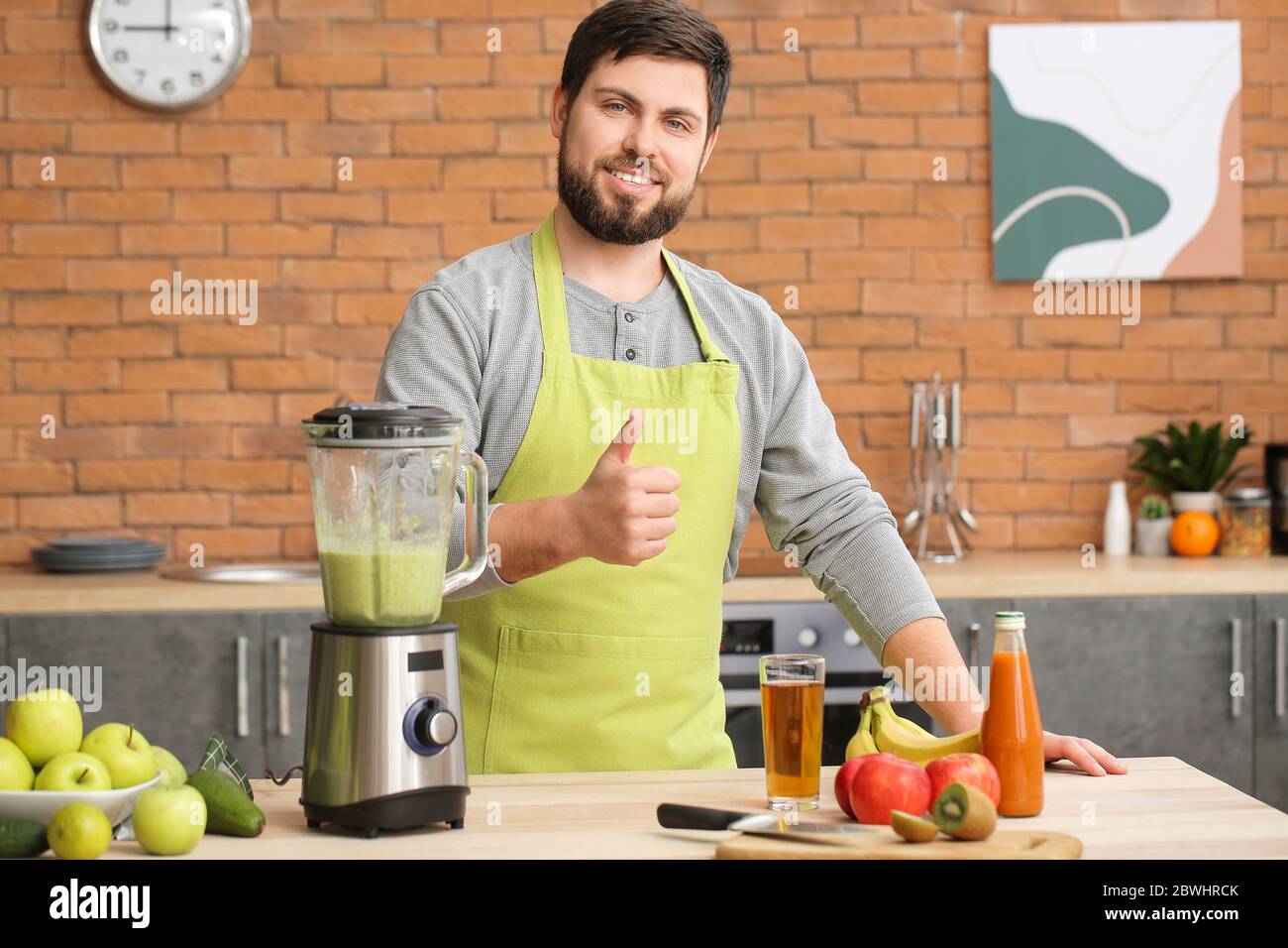 Man making healthy smoothie at home Stock Photo - Alamy