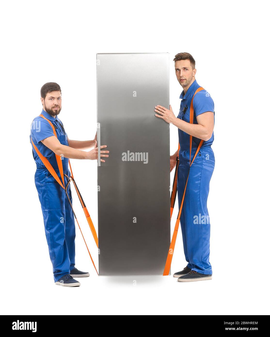 Loaders using cargo belts for carrying big fridge on white background ...