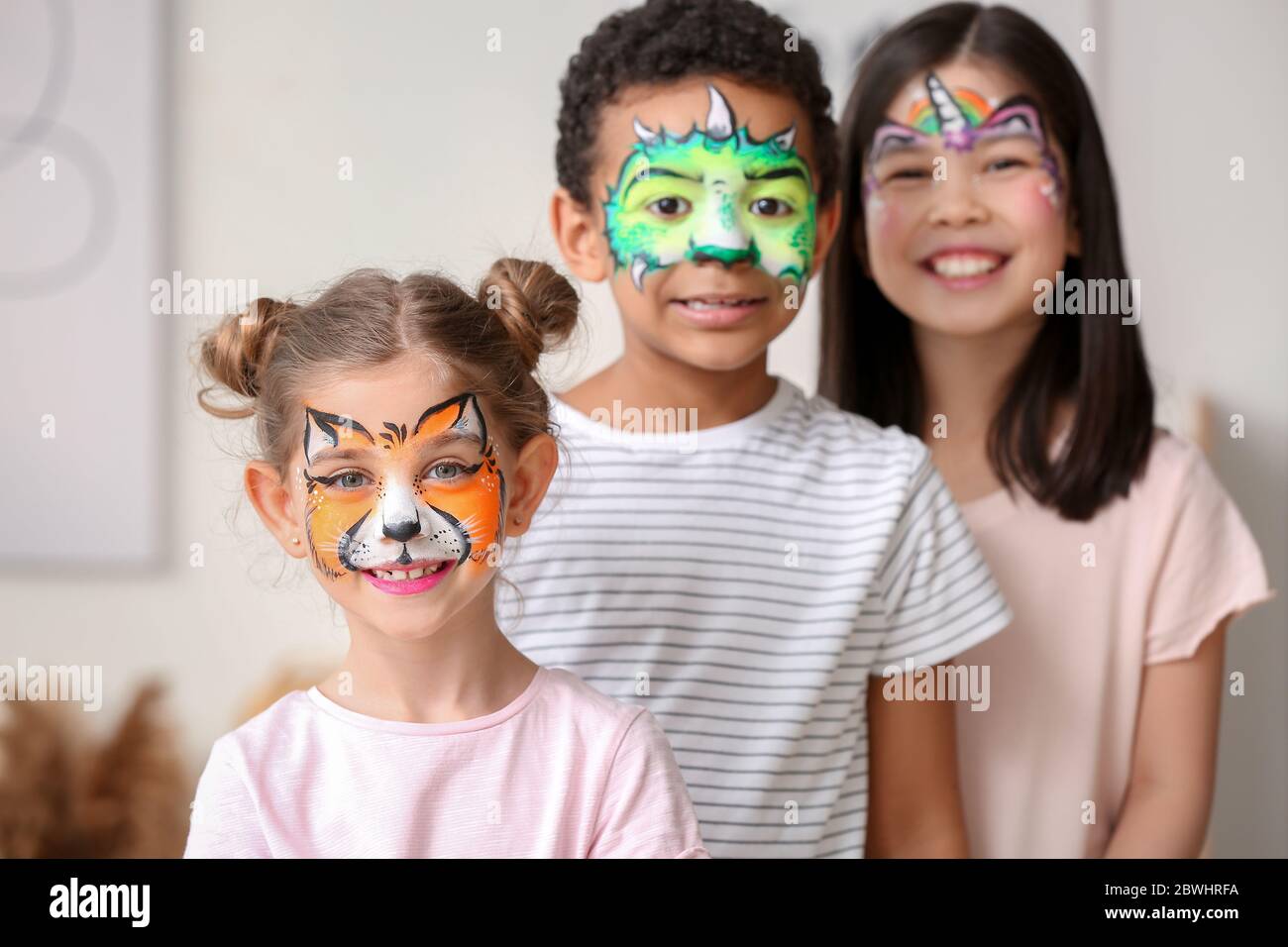 Funny little children with face painting at home Stock Photo - Alamy