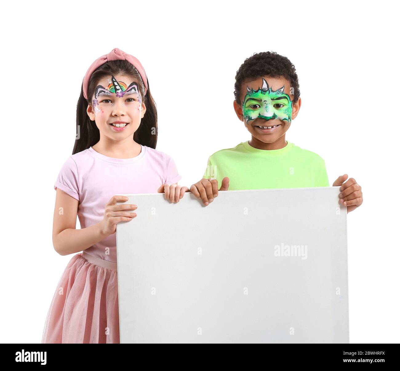 Funny children with face painting and blank poster on white background ...
