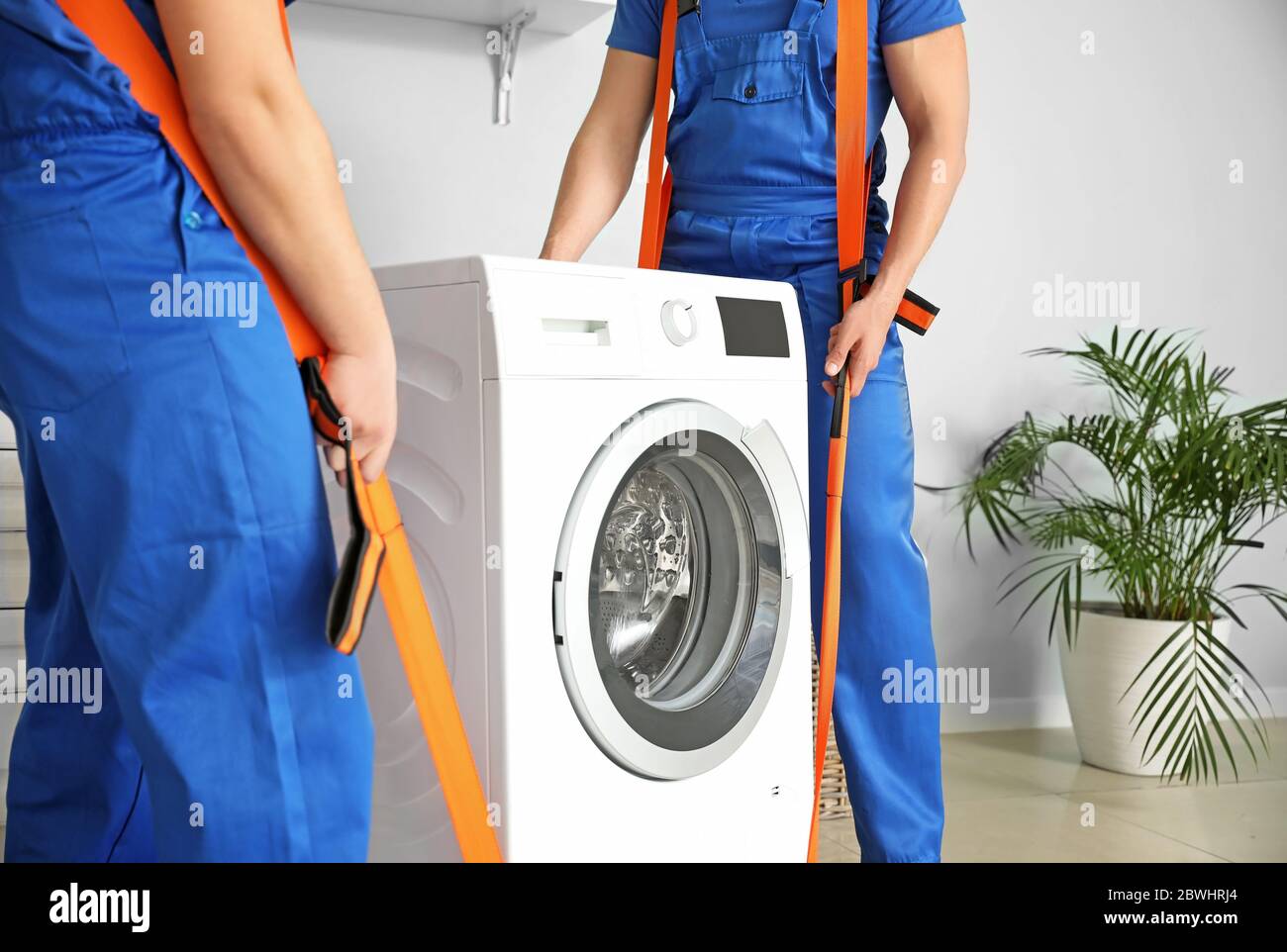 Carrying washing machine hi-res stock photography and images - Alamy