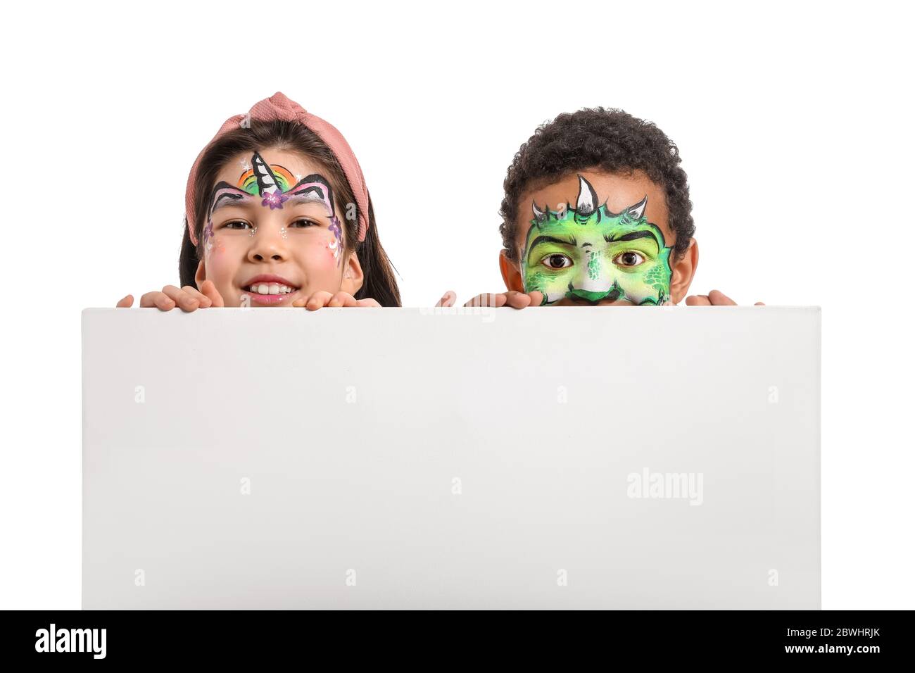 Funny little children with face painting and blank poster on white ...