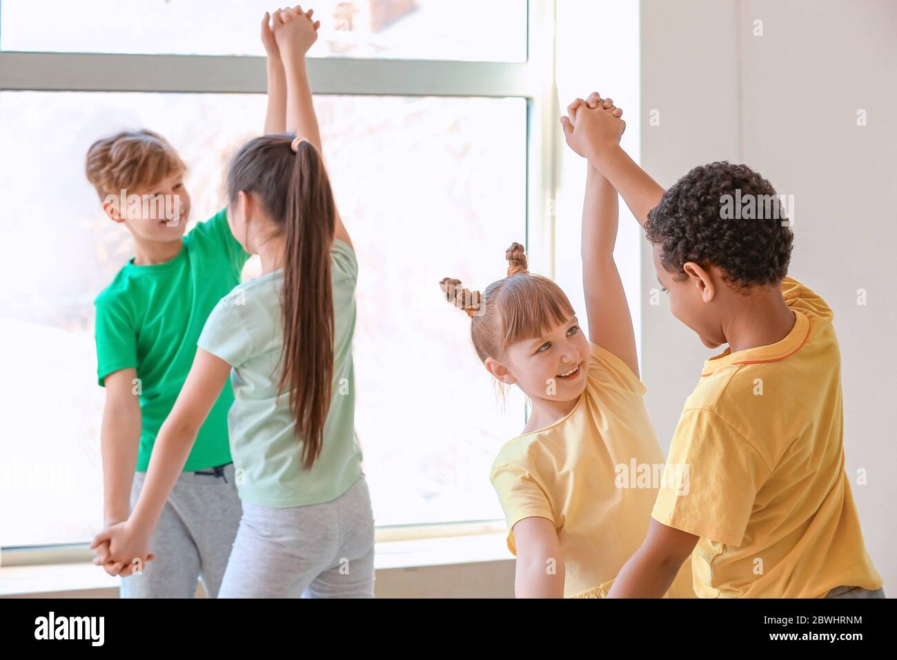 Cute little children dancing in studio Stock Photo - Alamy