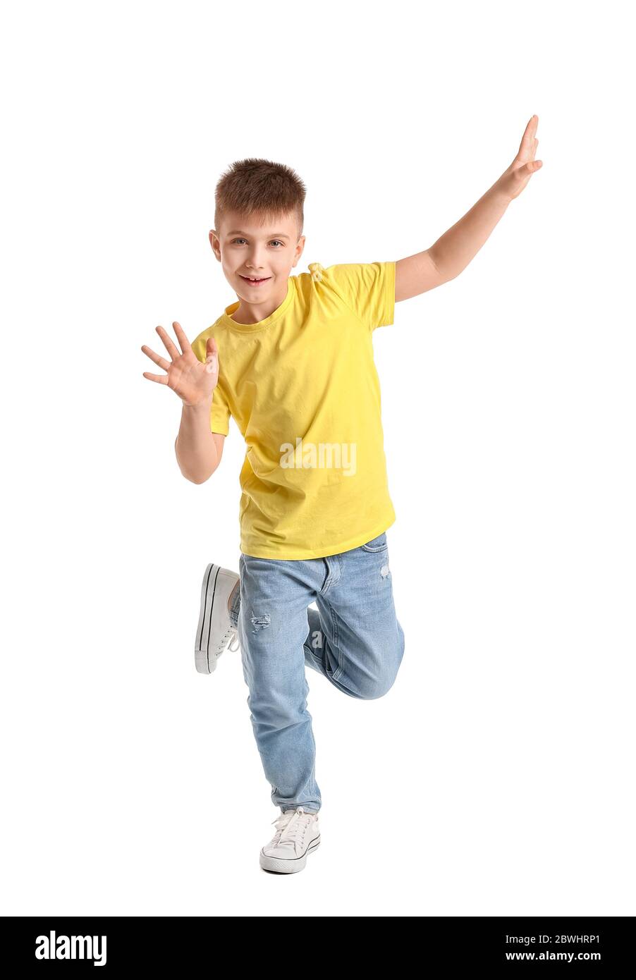 Cute dancing boy on white background Stock Photo - Alamy