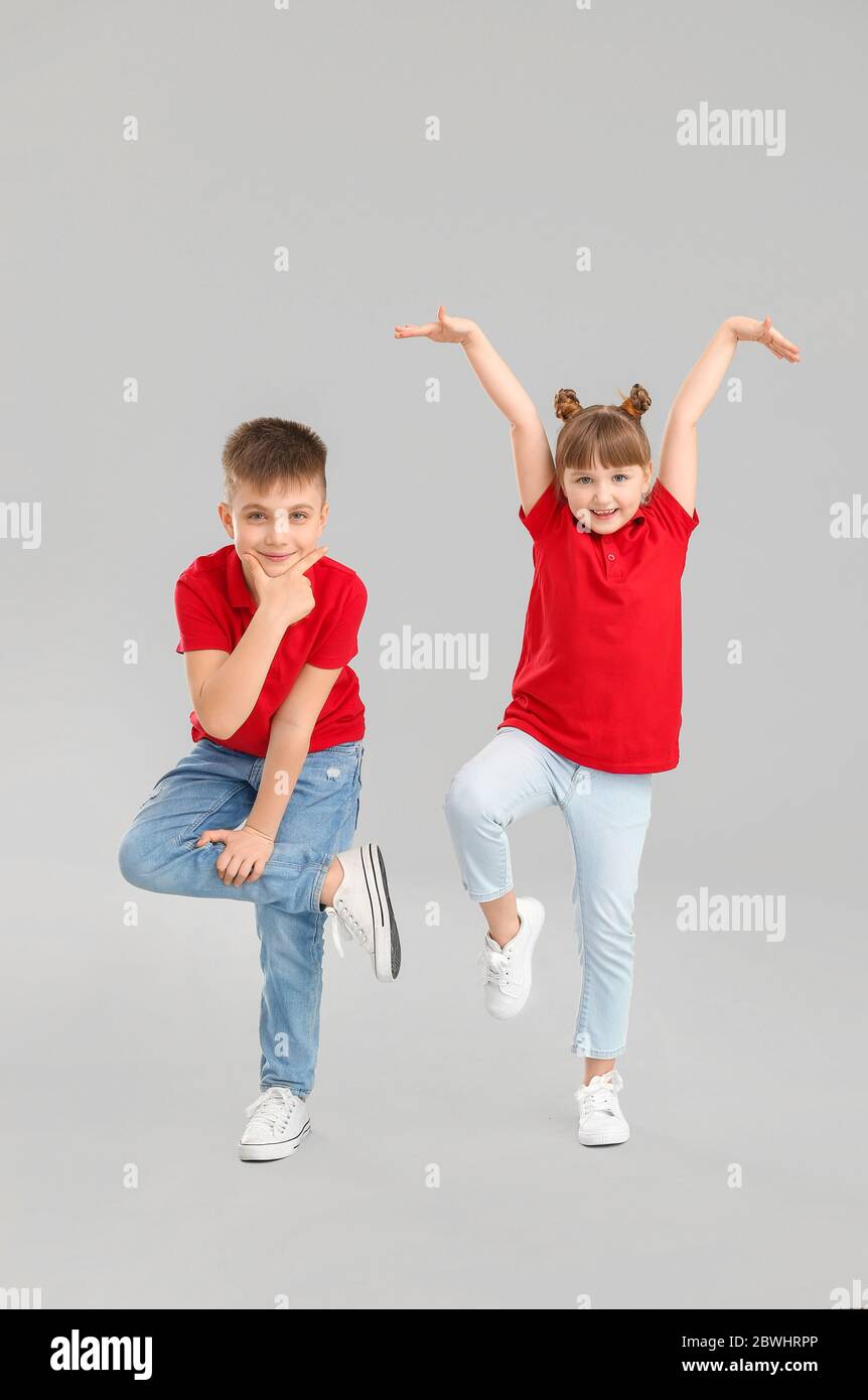 Cute little dancers on grey background Stock Photo - Alamy