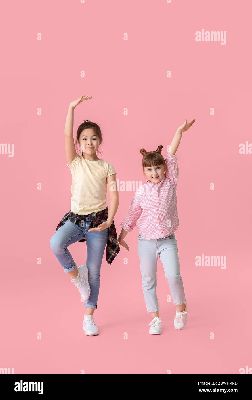 Cute little dancers on color background Stock Photo - Alamy