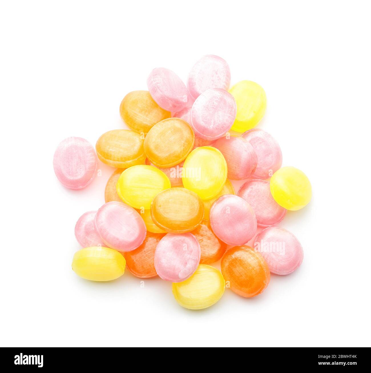 Sweet candies on white background Stock Photo - Alamy