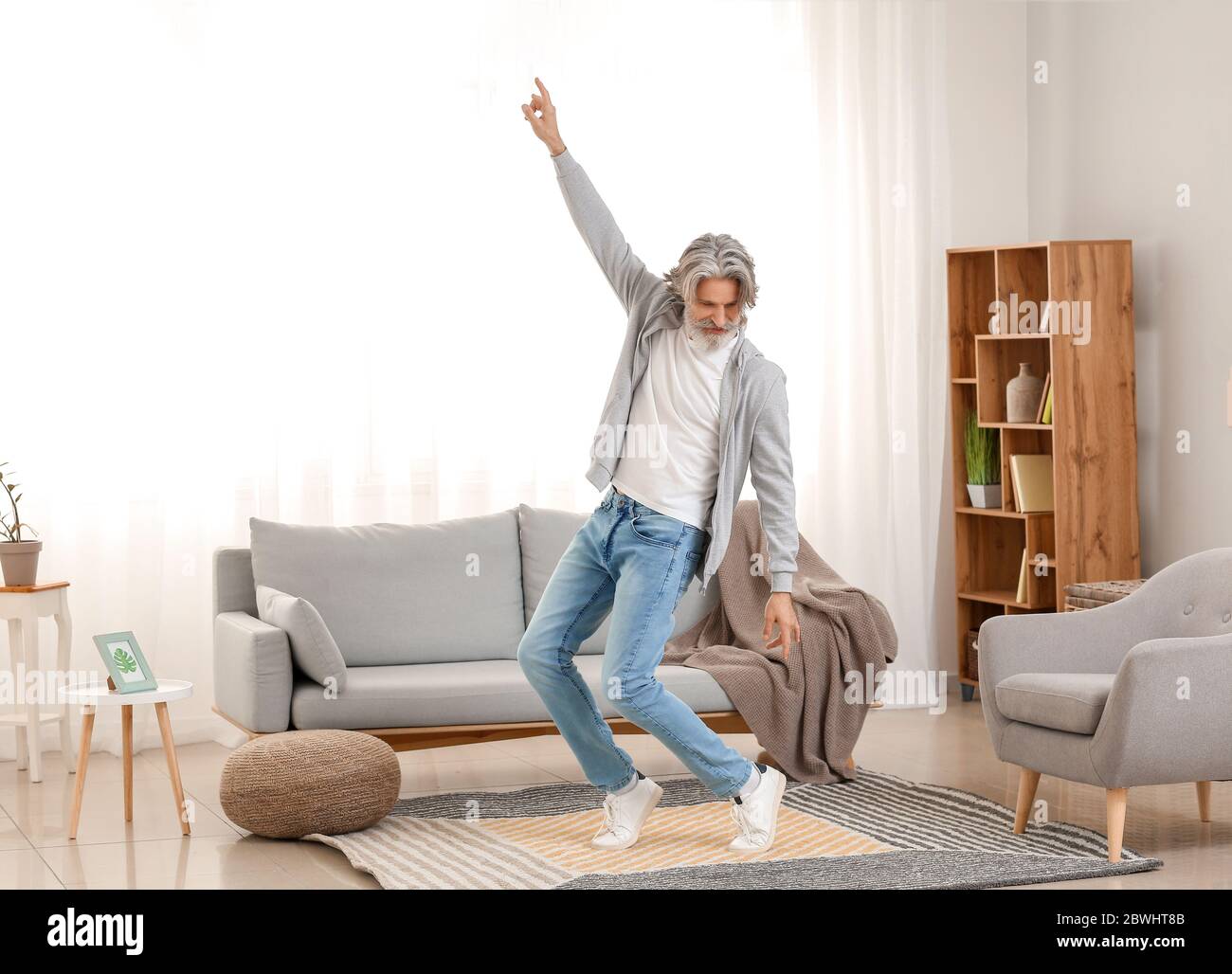 Cool senior man dancing at home Stock Photo - Alamy