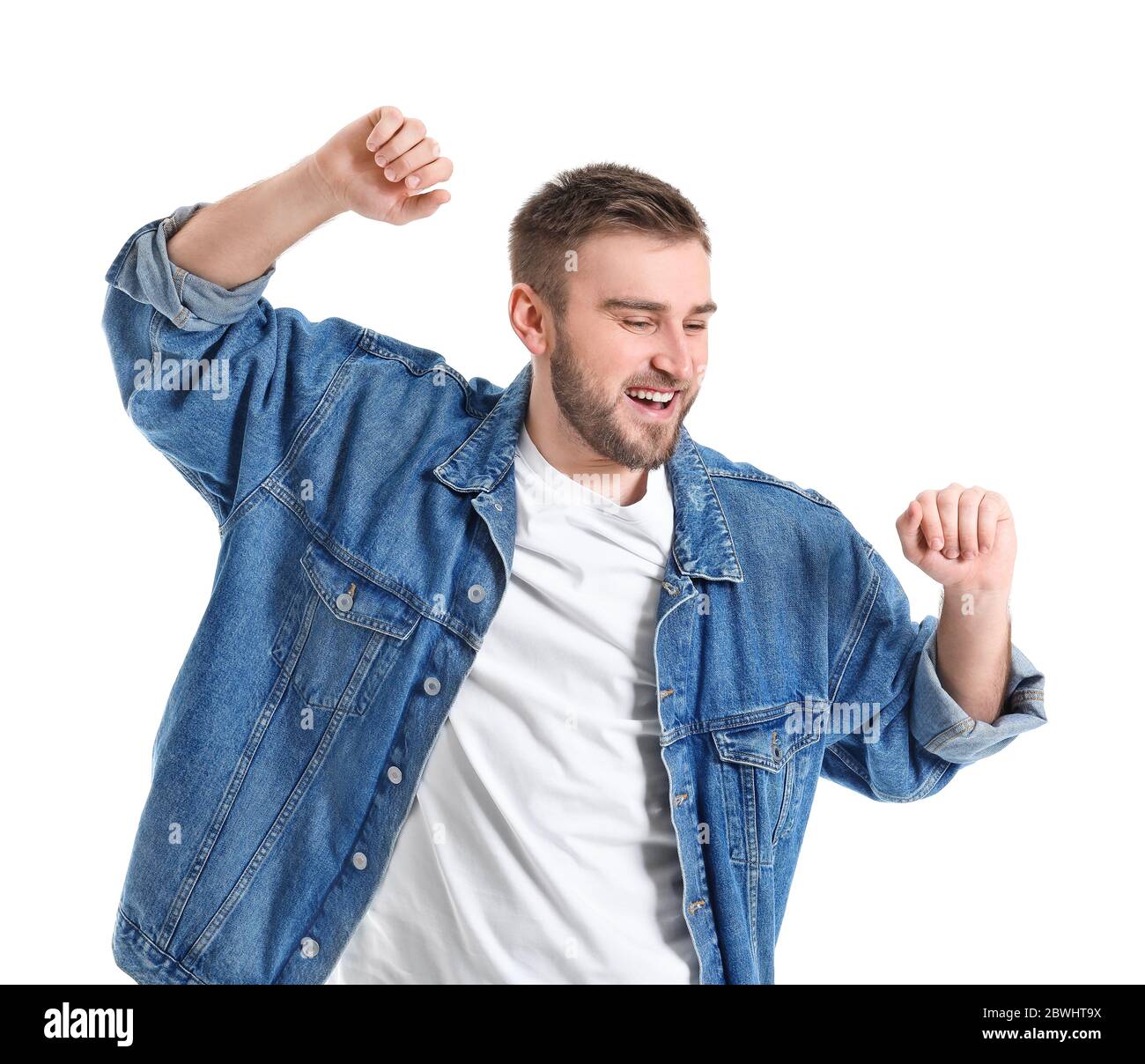 Handsome young man dancing against white background Stock Photo - Alamy
