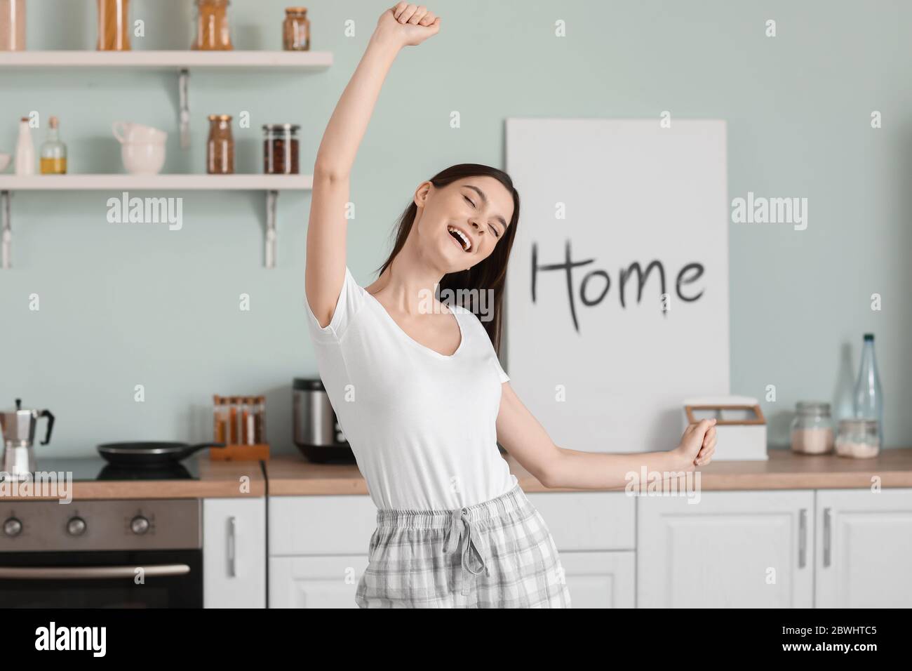 Woman dancing in kitchen hi-res stock photography and images - Alamy