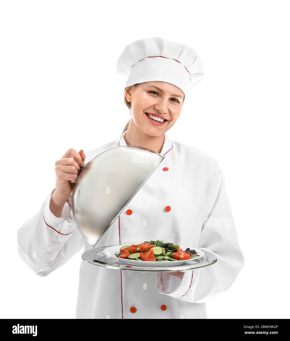 Beautiful female chef with salad on white background Stock Photo - Alamy