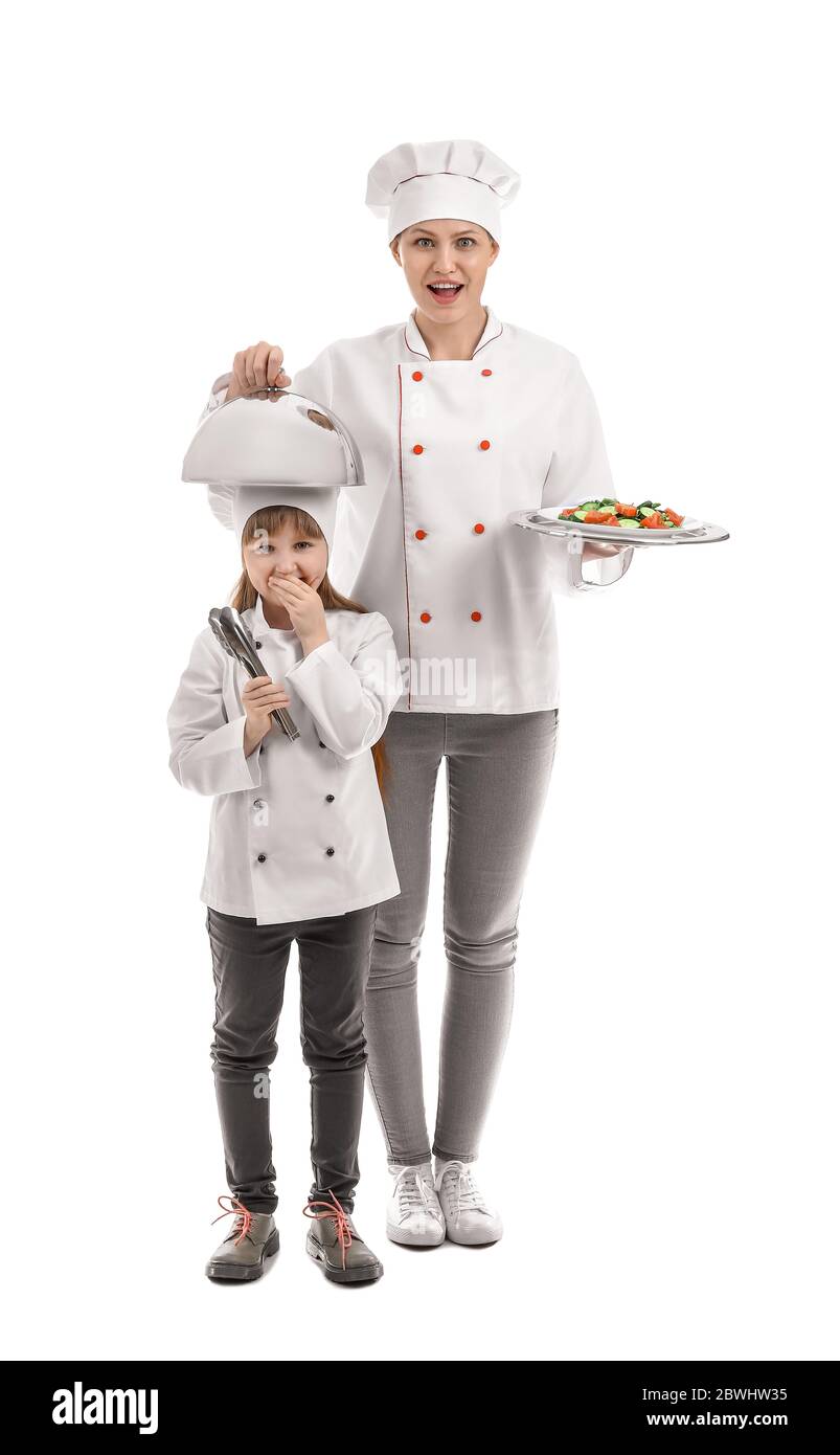 Portrait of female chef and her little daughter on white background ...
