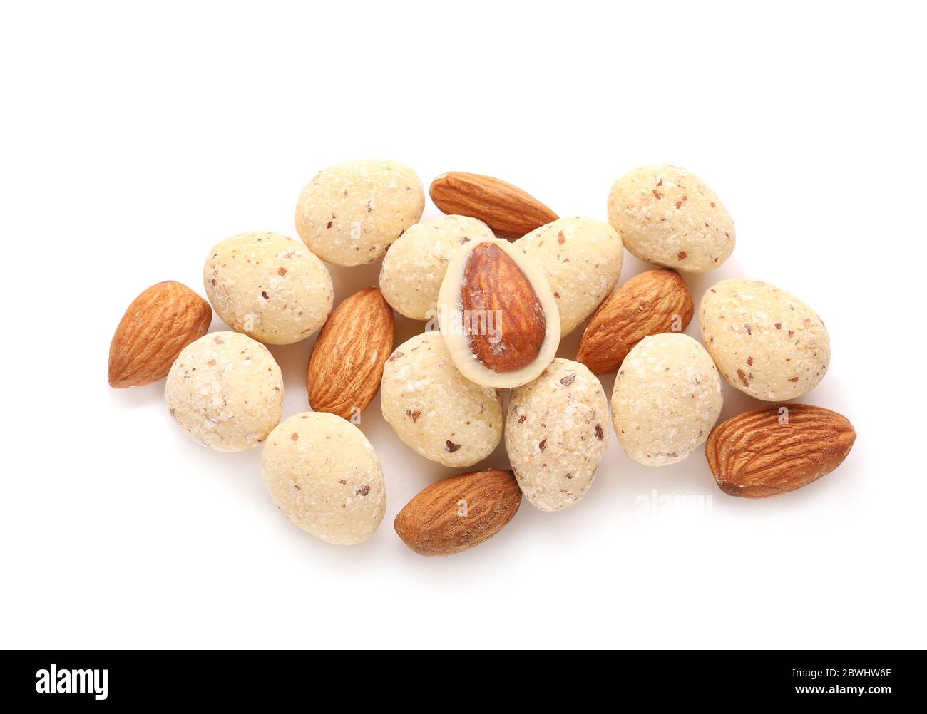 Tasty coated nuts on white background Stock Photo - Alamy