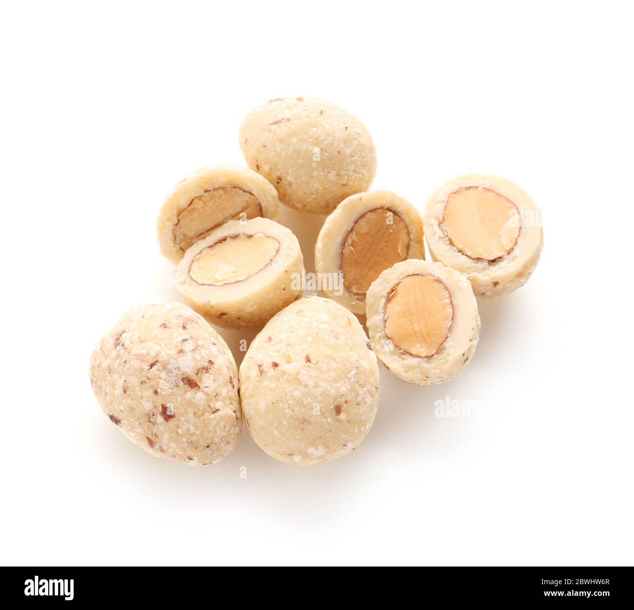Tasty coated nuts on white background Stock Photo - Alamy