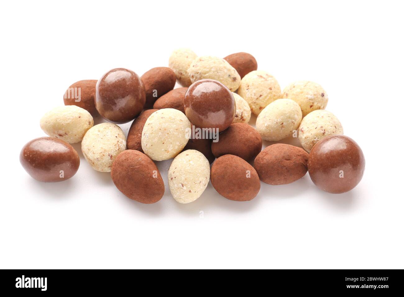 Tasty chocolate nuts on white background Stock Photo - Alamy