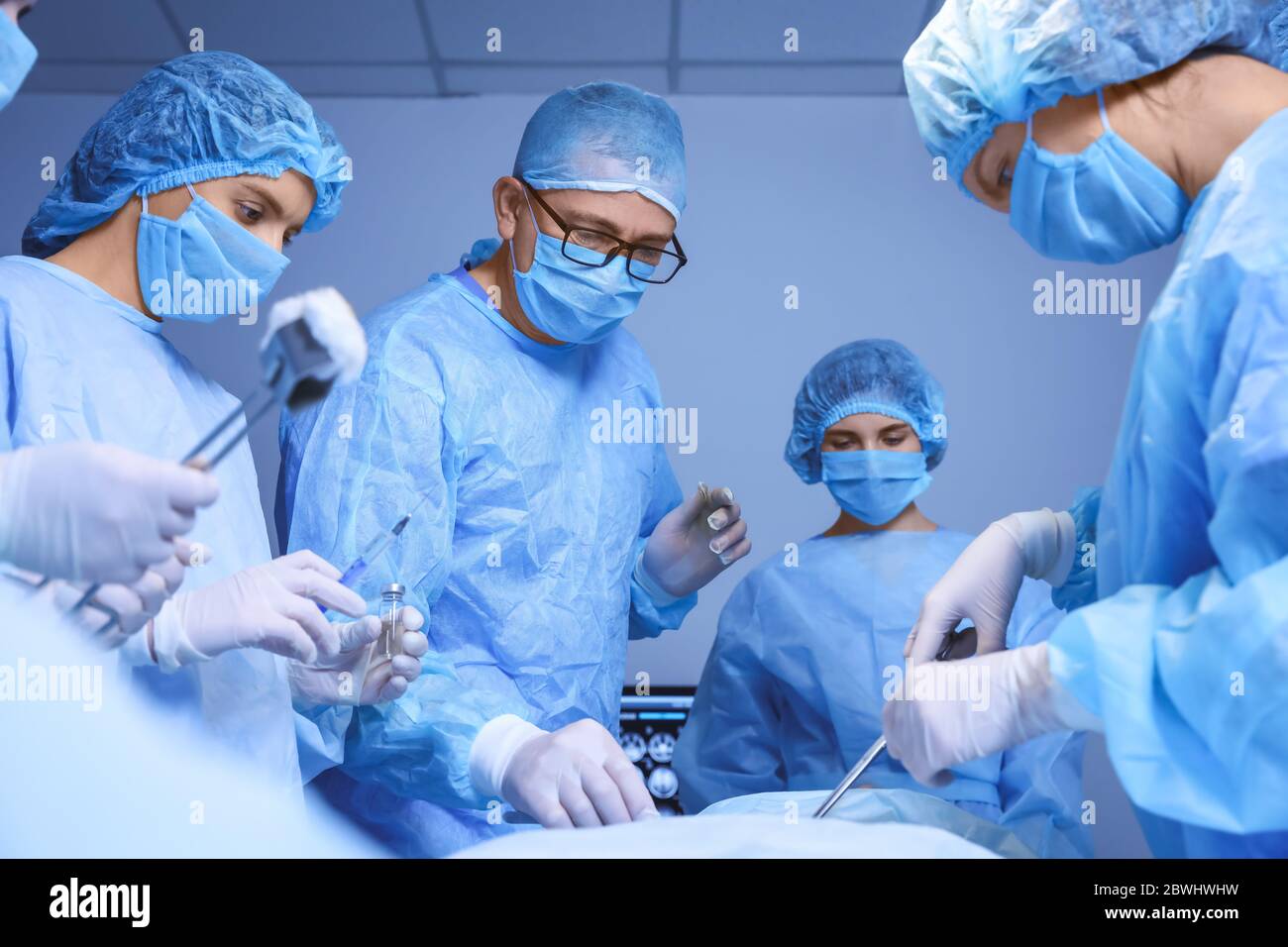 Operating of patient in modern hospital Stock Photo - Alamy