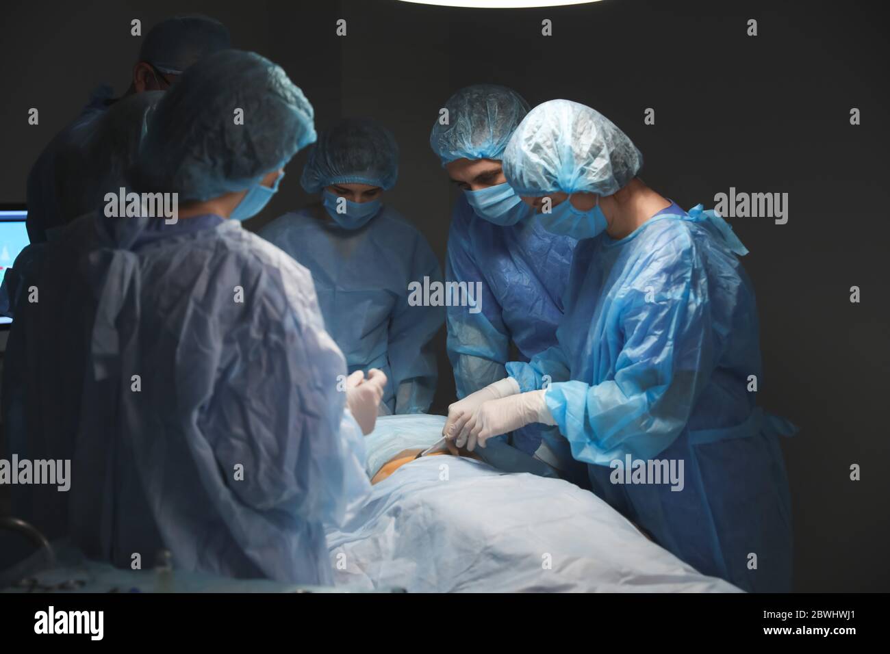 Operating of patient in modern hospital Stock Photo - Alamy