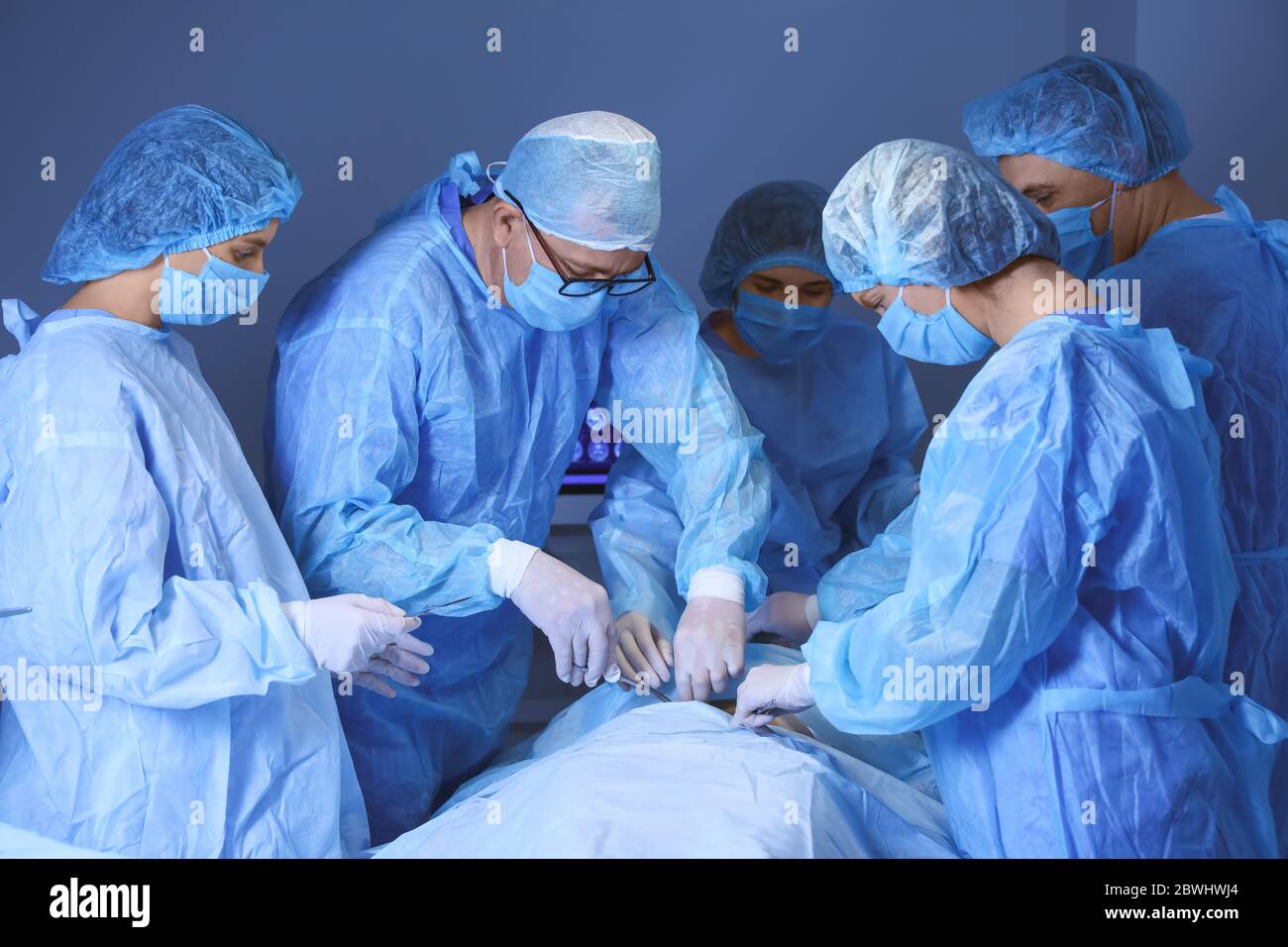 Operating of patient in modern hospital Stock Photo - Alamy