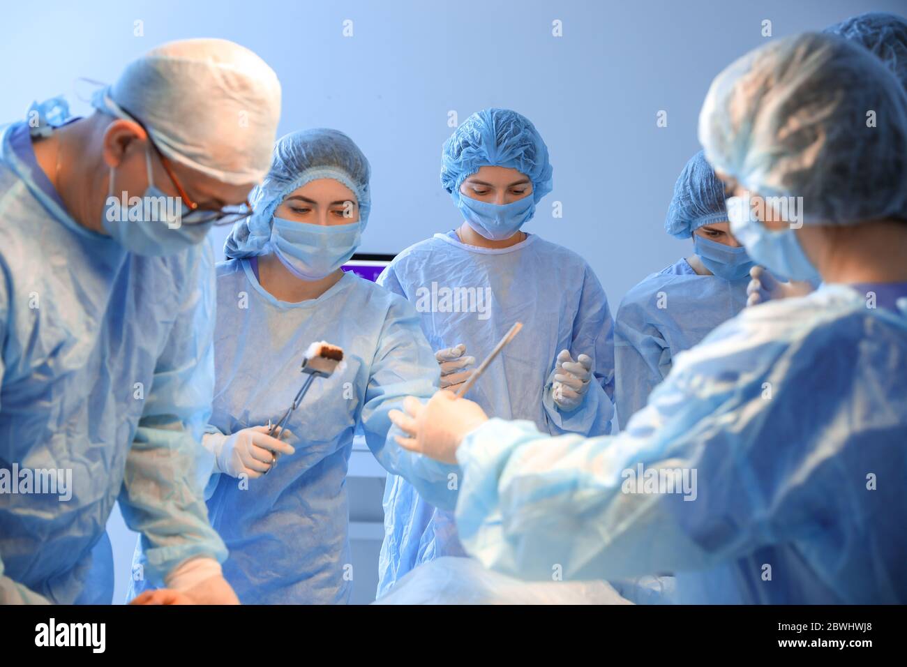 Operating of patient in modern hospital Stock Photo - Alamy