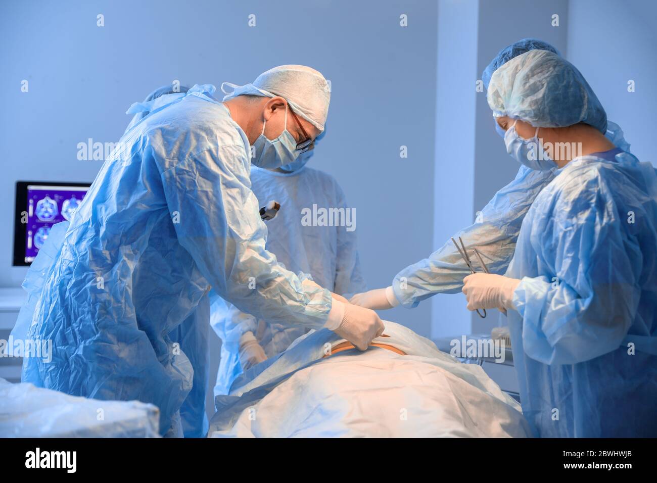 Operating of patient in modern hospital Stock Photo - Alamy