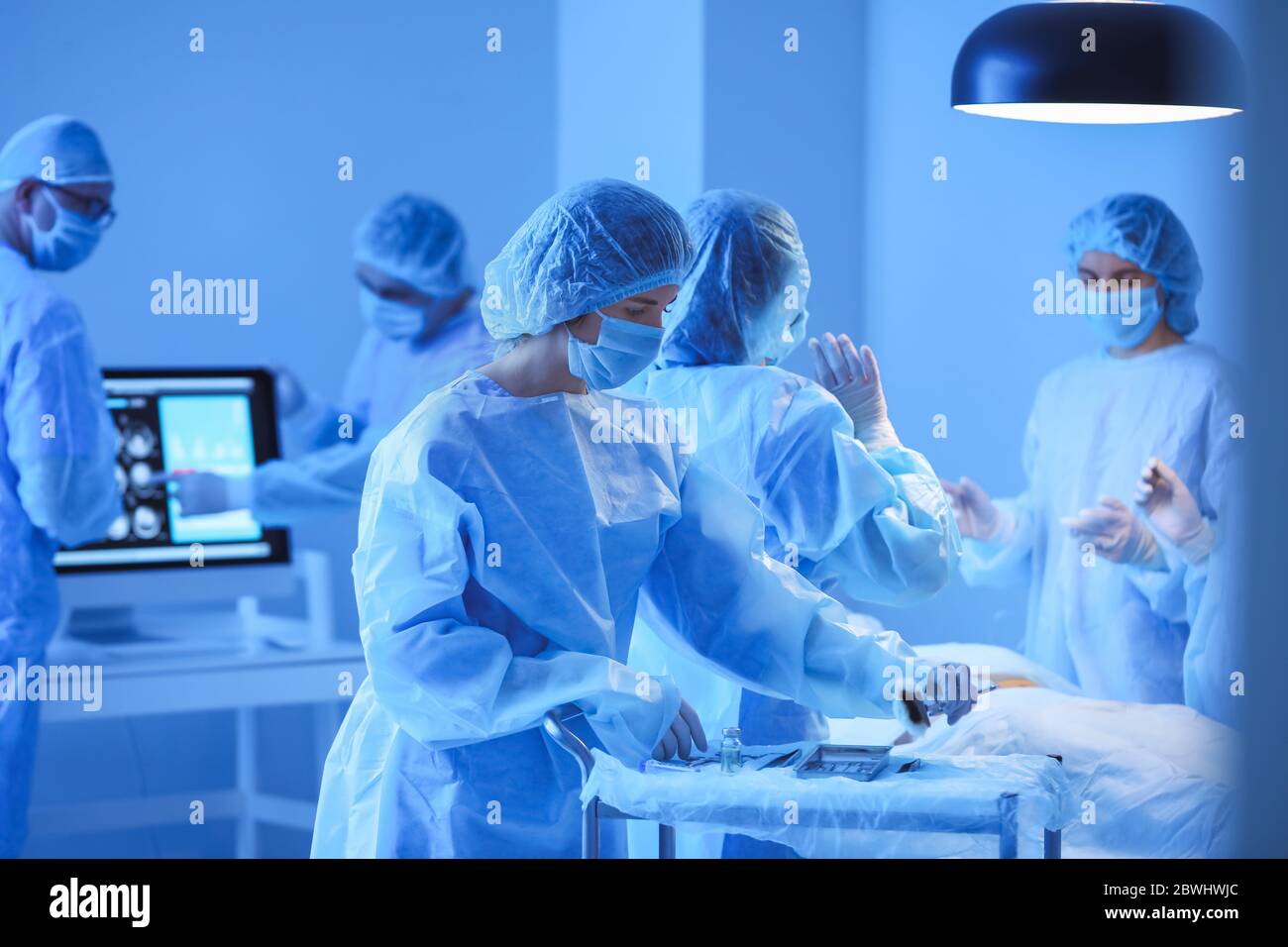 Operating of patient in modern hospital Stock Photo - Alamy