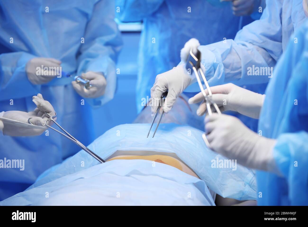 Operating of patient in modern hospital Stock Photo - Alamy