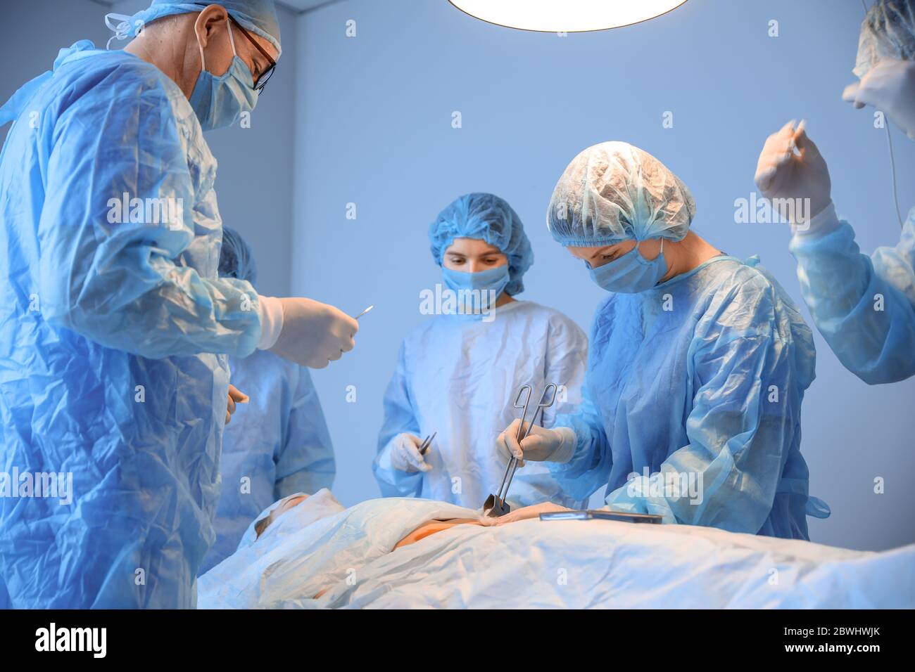 Operating of patient in modern hospital Stock Photo - Alamy