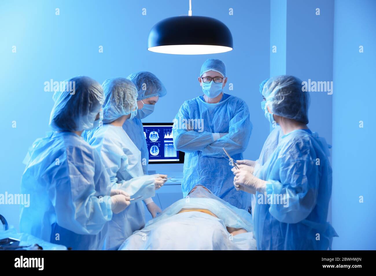 Operating of patient in modern hospital Stock Photo - Alamy