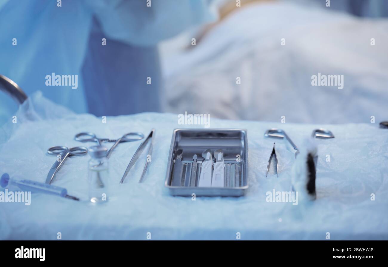 Set of surgical instruments on table in clinic Stock Photo - Alamy