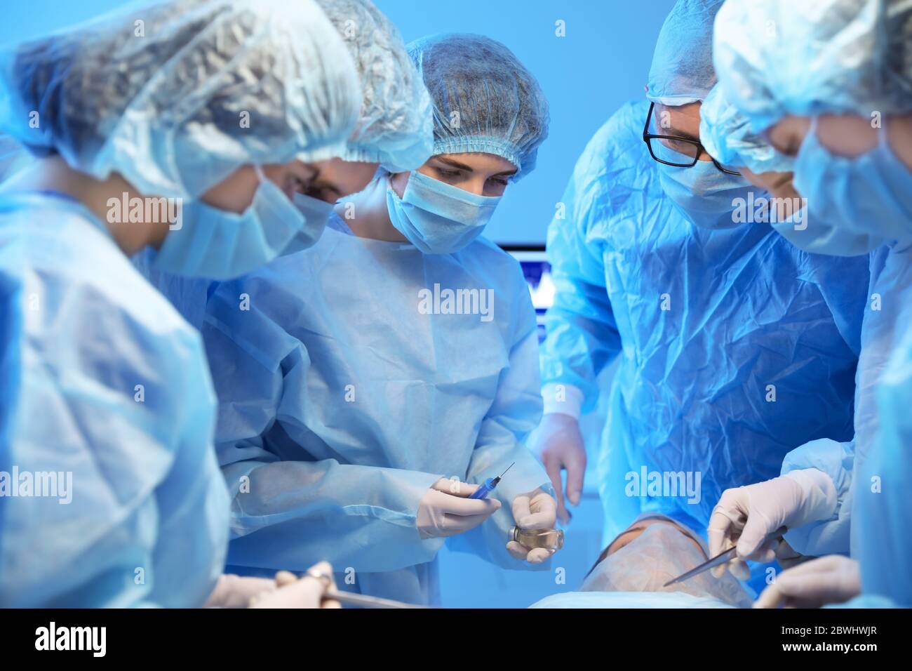 Operating of patient in modern hospital Stock Photo - Alamy
