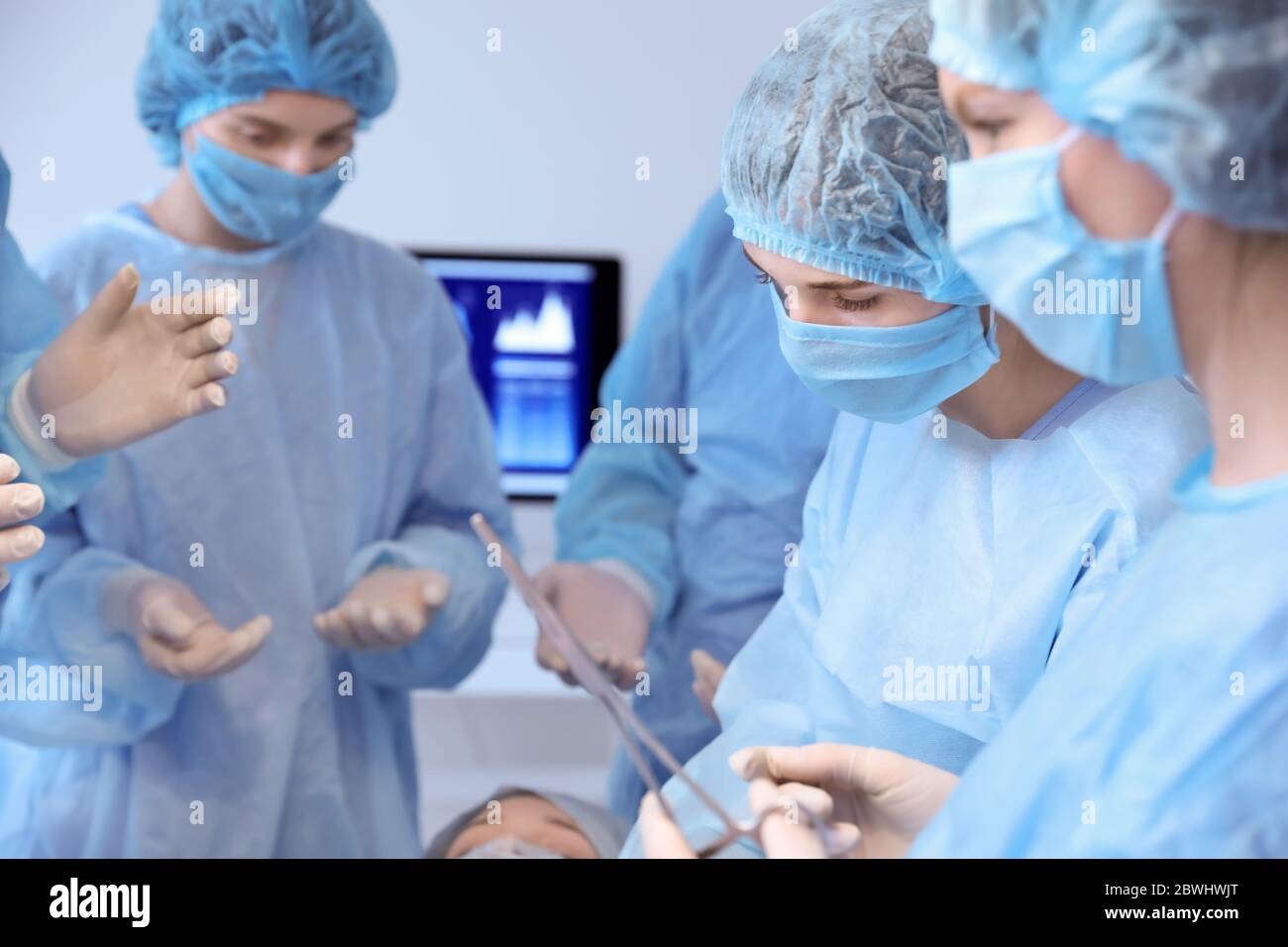 Operating of patient in modern hospital Stock Photo - Alamy