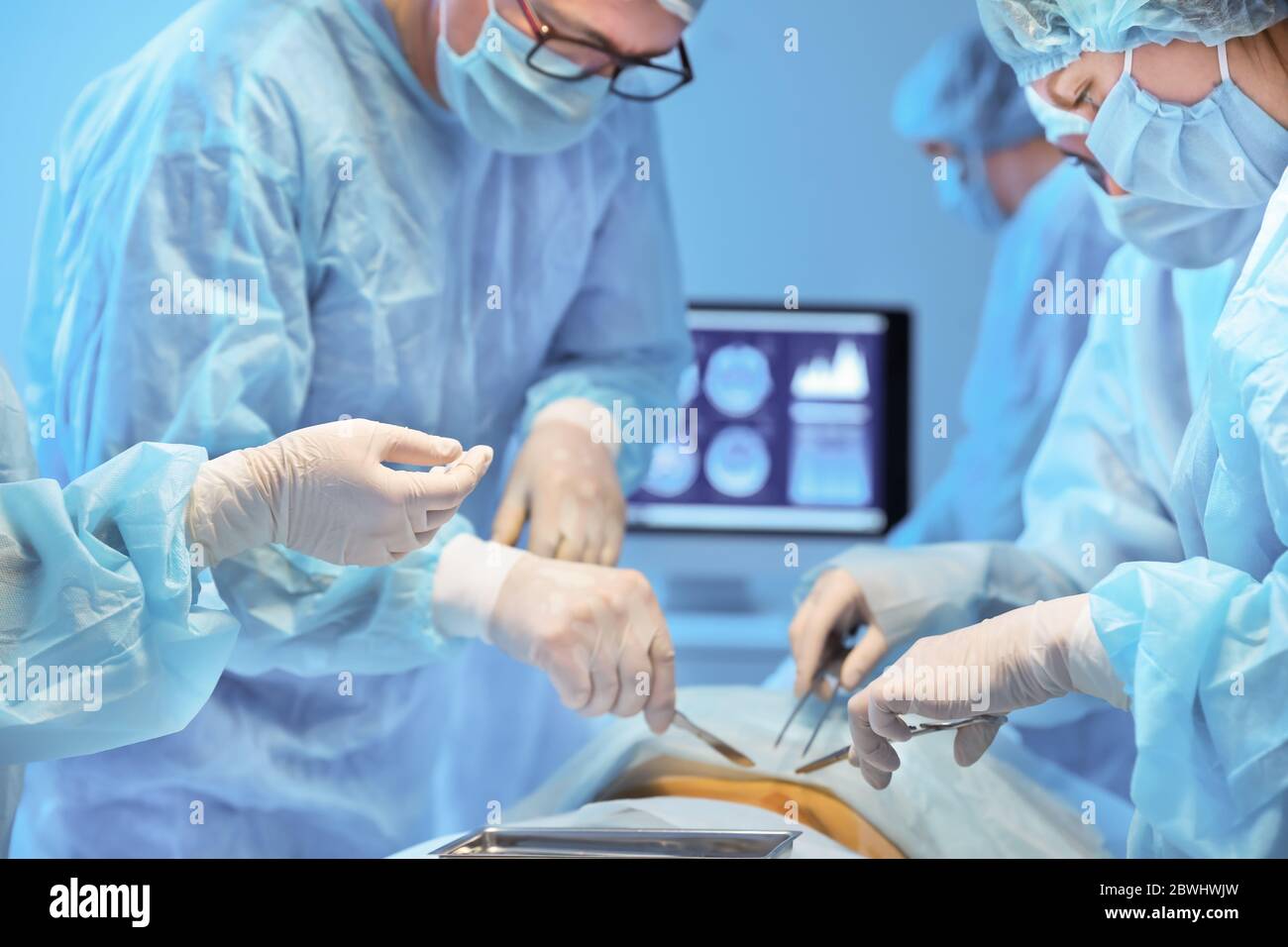 Operating of patient in modern hospital Stock Photo - Alamy
