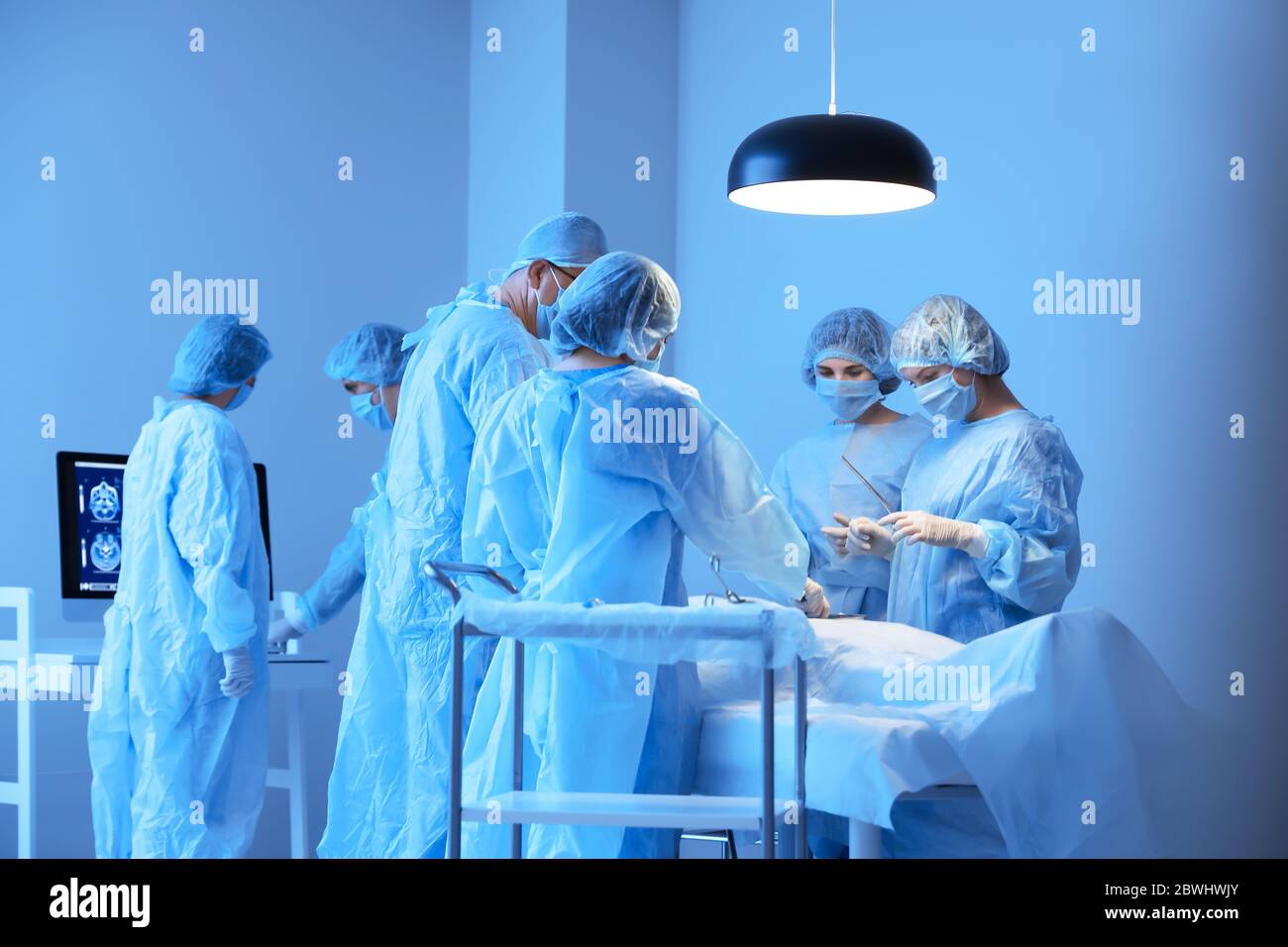 Operating of patient in modern hospital Stock Photo - Alamy
