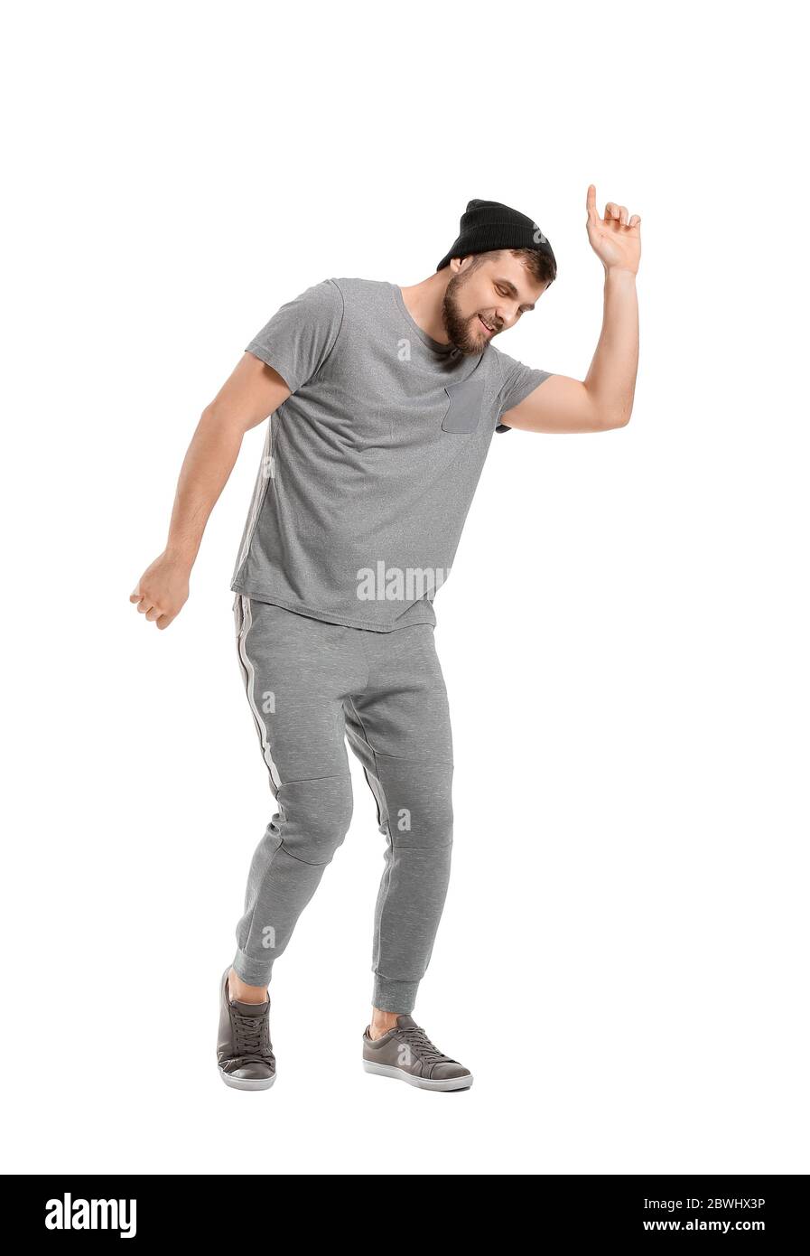 Handsome young man dancing against white background Stock Photo - Alamy
