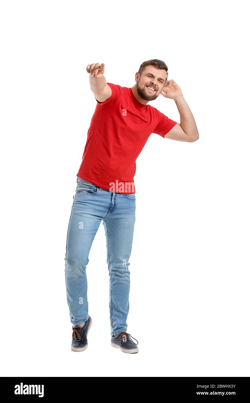 Handsome young man dancing against white background Stock Photo - Alamy