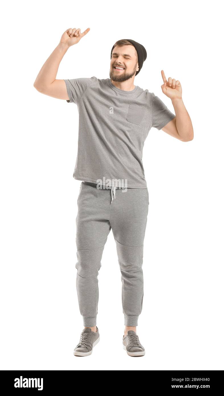 Handsome young man dancing against white background Stock Photo - Alamy
