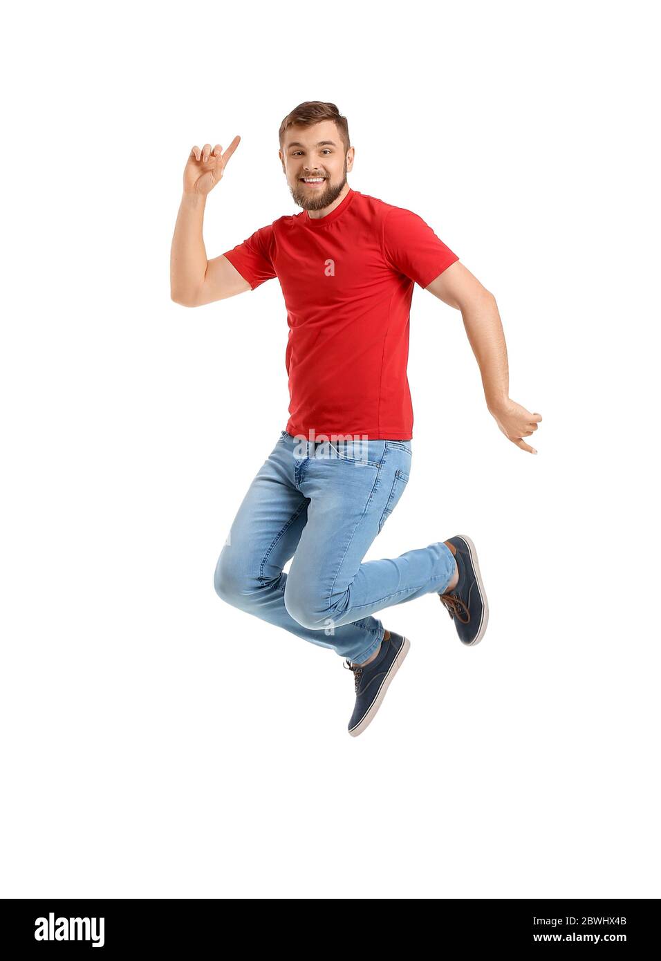 Handsome young man dancing against white background Stock Photo - Alamy