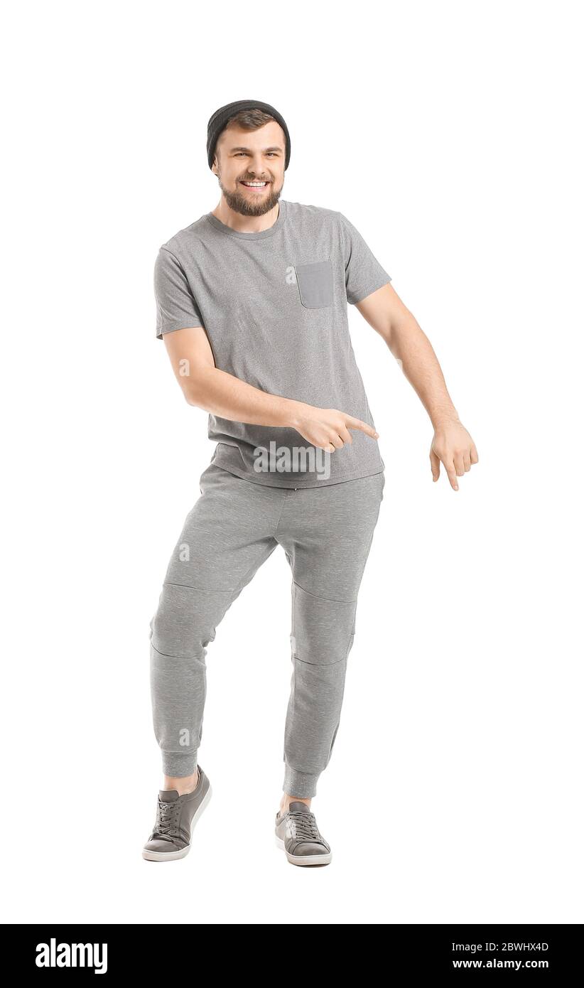 Handsome young man dancing against white background Stock Photo - Alamy