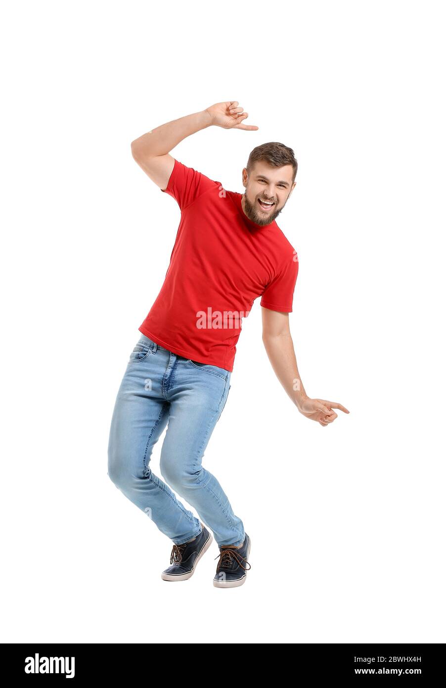 Handsome young man dancing against white background Stock Photo - Alamy