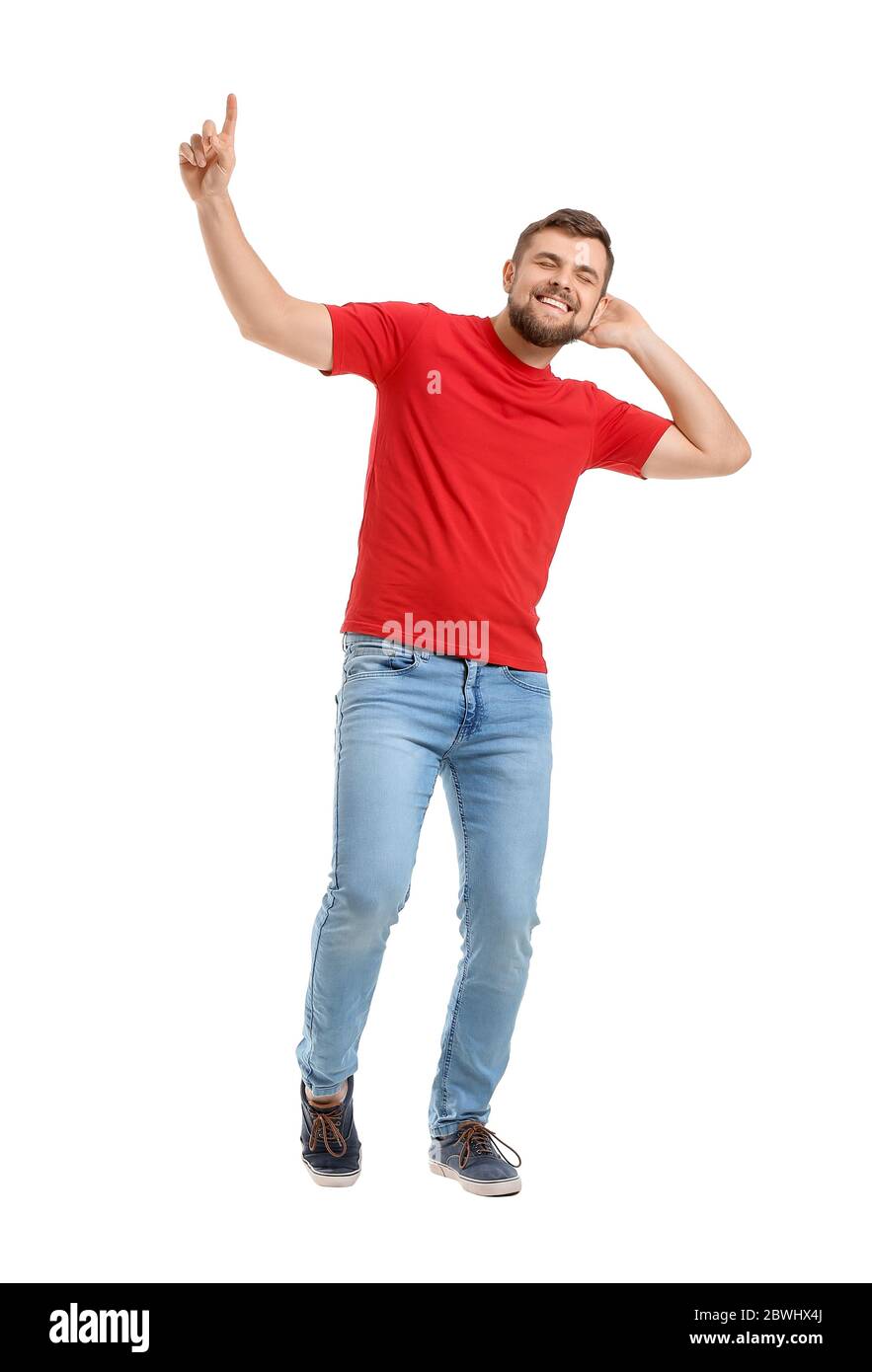 Handsome young man dancing against white background Stock Photo - Alamy
