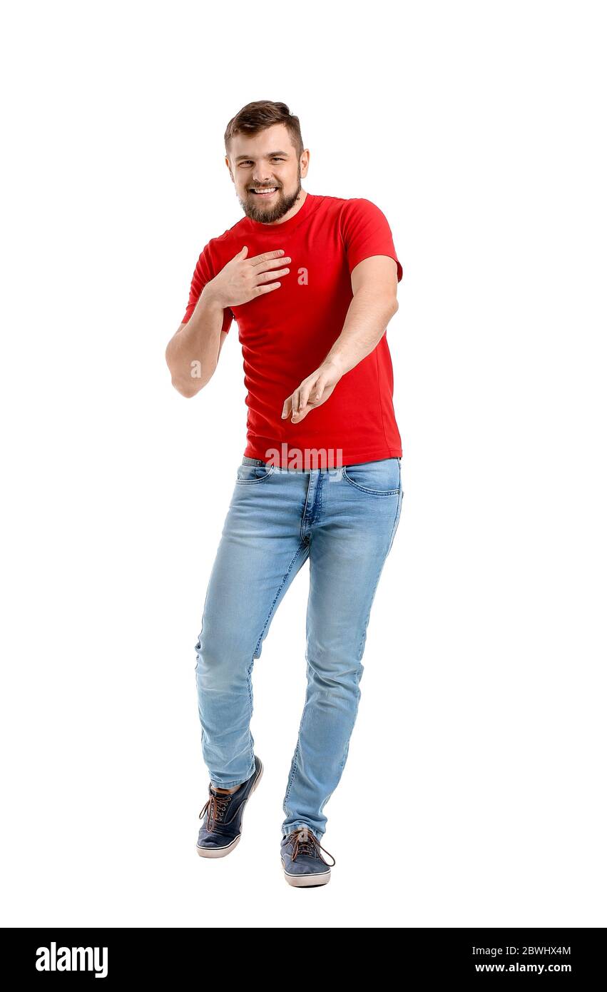 Handsome young man dancing against white background Stock Photo - Alamy