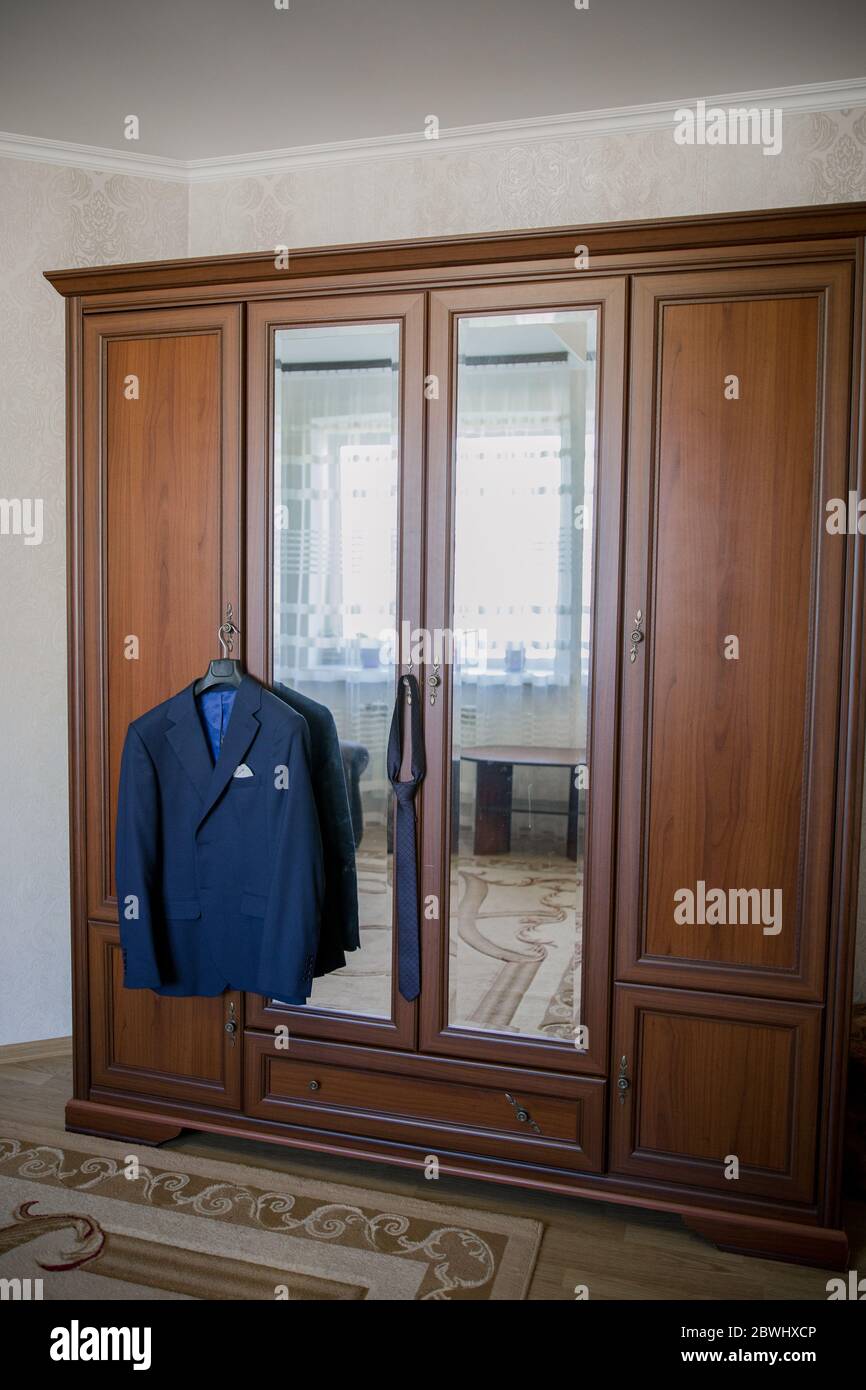 Business uniform suit on hanger hi-res stock photography and images - Alamy