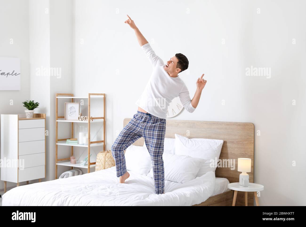 Handsome young man dancing at home Stock Photo - Alamy