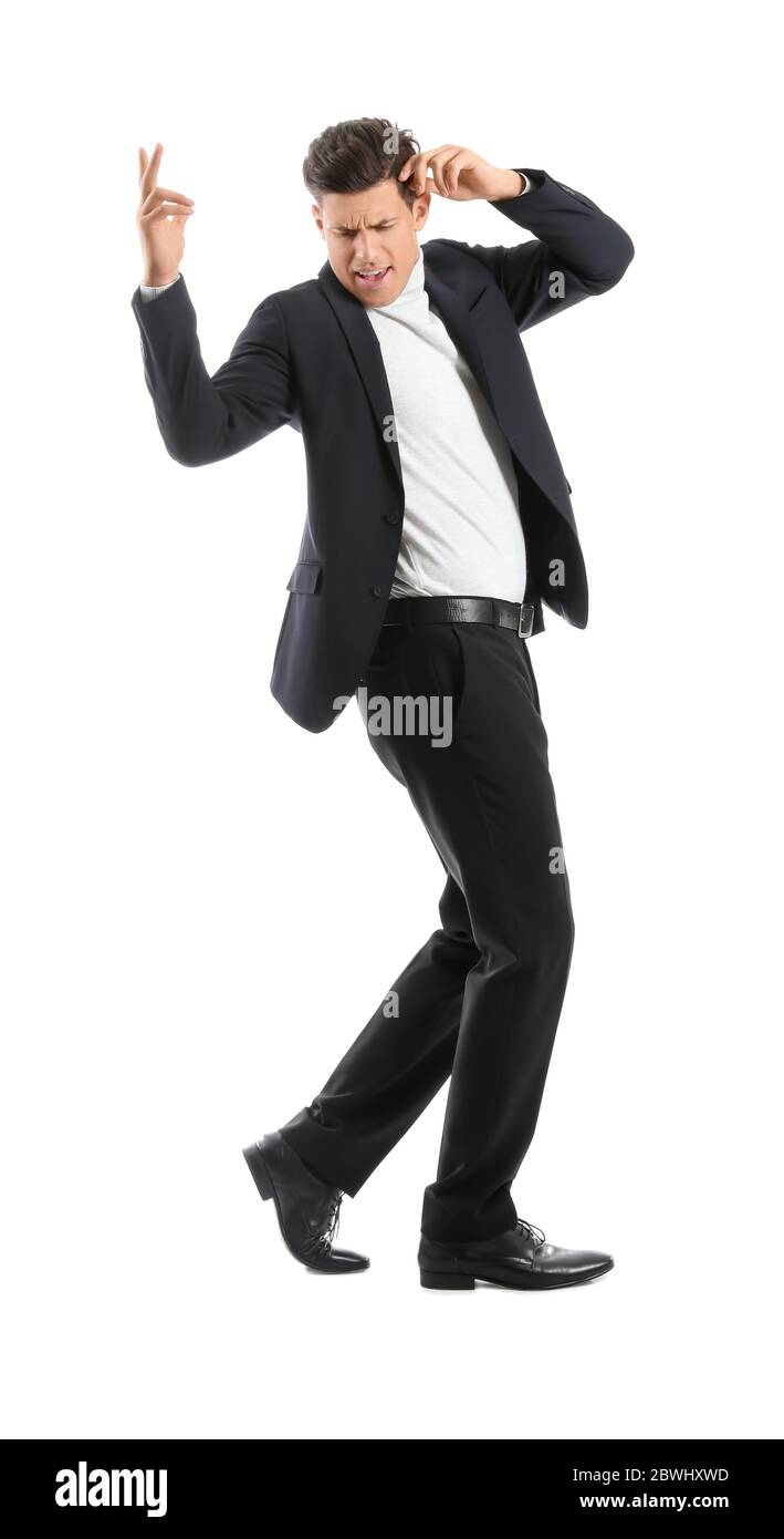 Handsome young man dancing against white background Stock Photo - Alamy