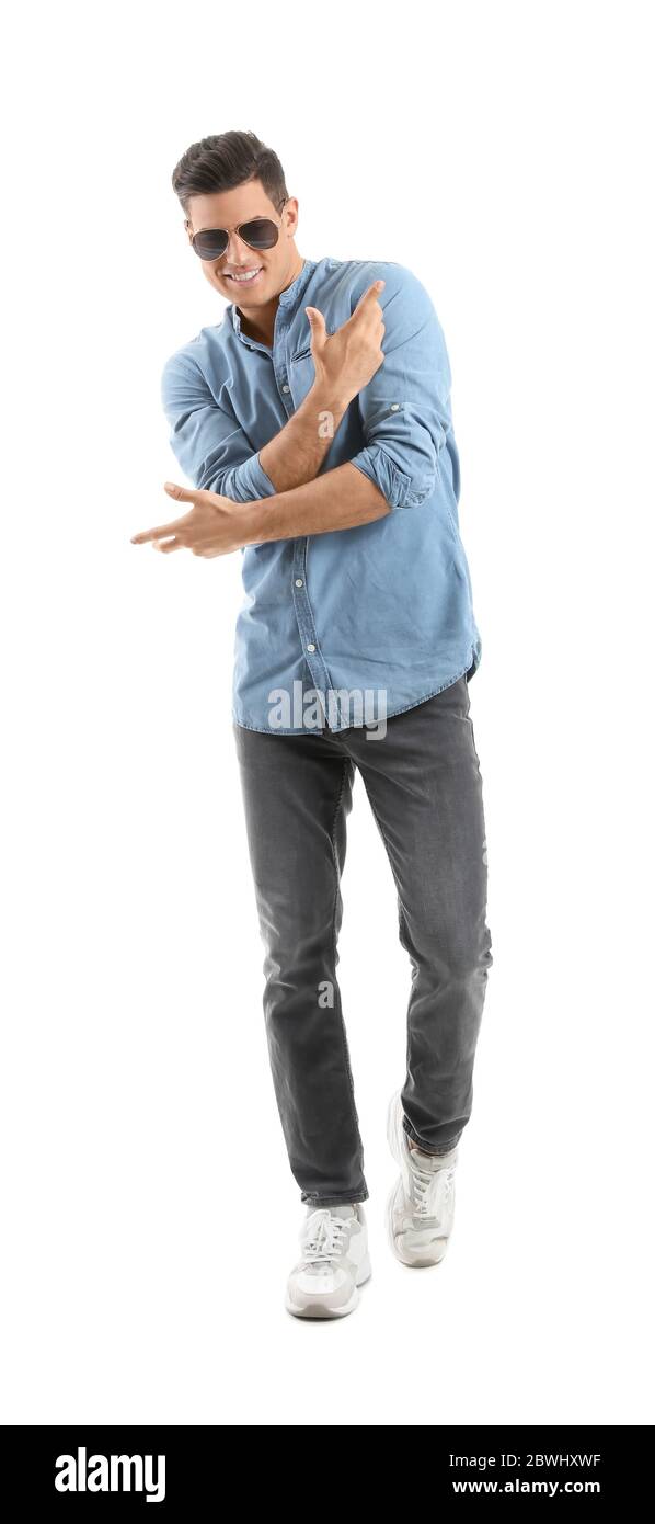 Handsome young man dancing against white background Stock Photo - Alamy