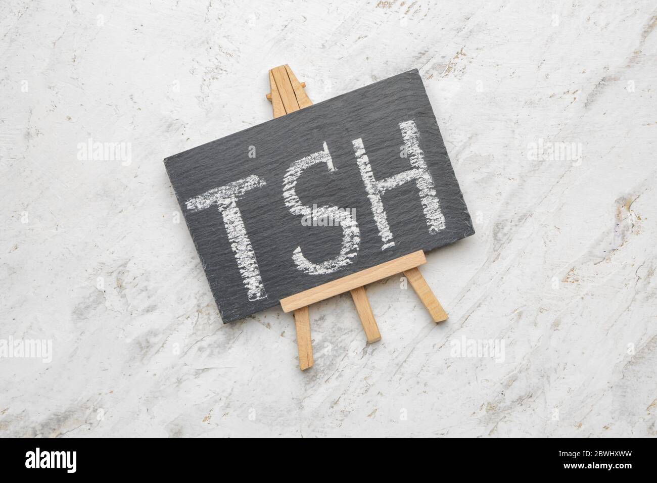 Board with abbreviation TSH on white background Stock Photo - Alamy