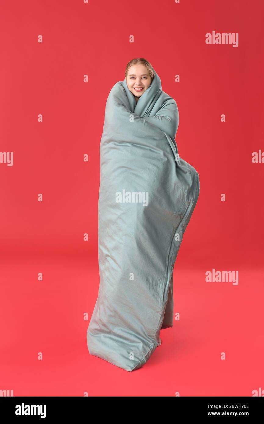 Young woman wrapped in blanket hi-res stock photography and images - Alamy