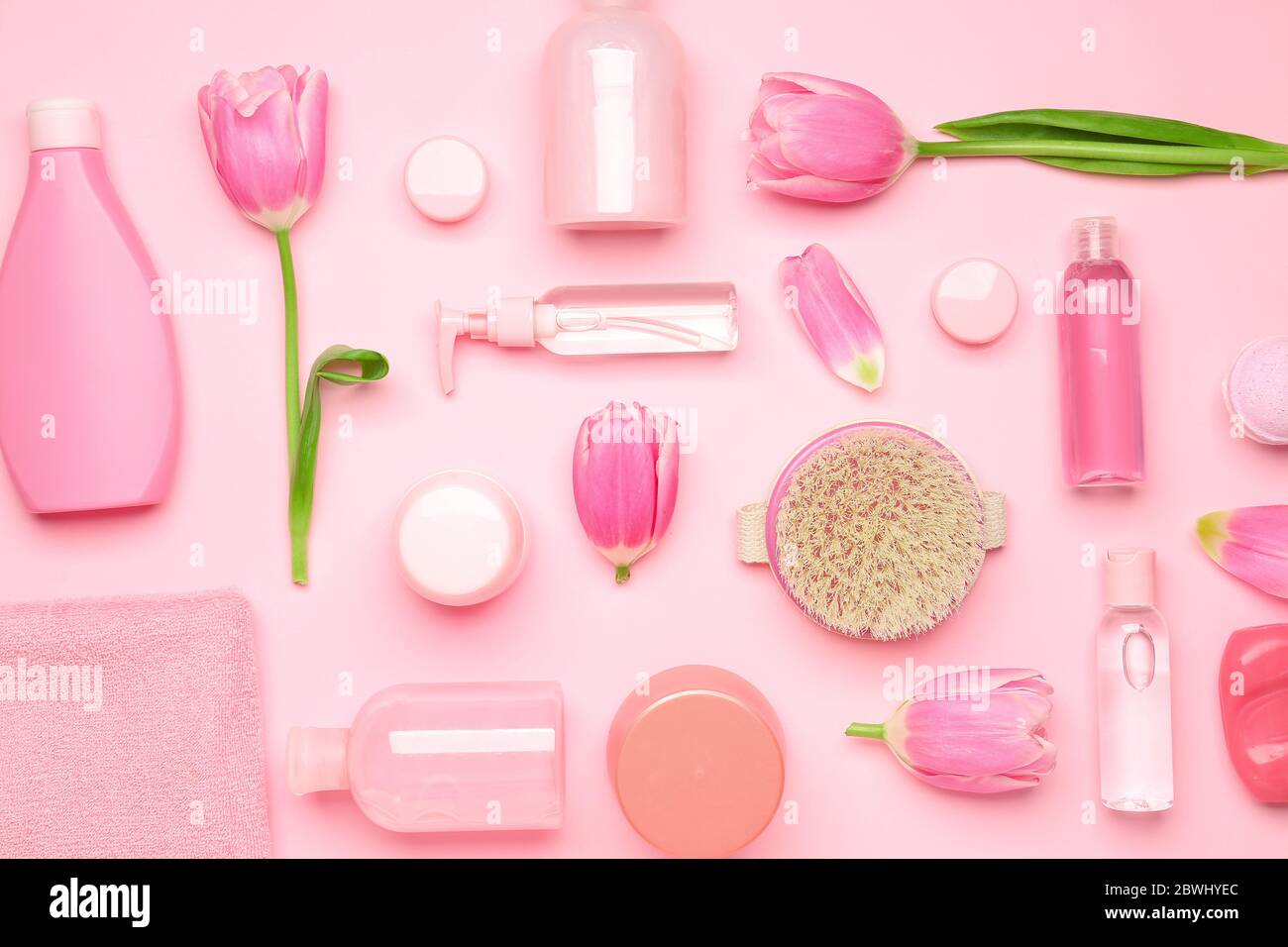 Shower gels with bath supplies on color background Stock Photo - Alamy